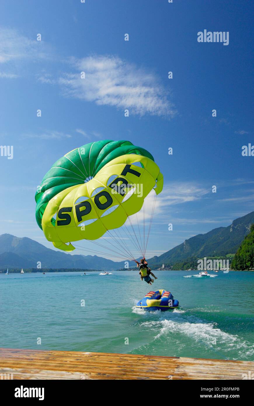 Tandem flight, parasailing at lake Abersee (lake Wolfgangsee ...