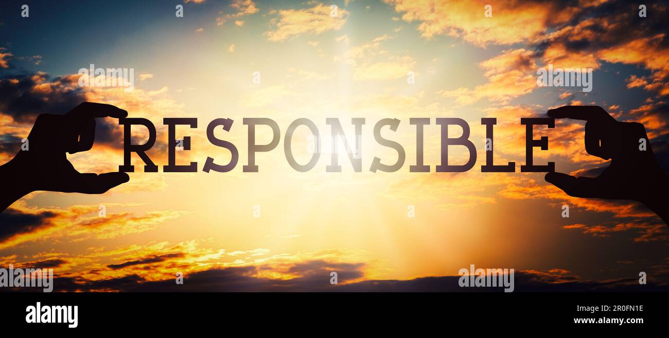 Responsible - human hands holding black silhouette word Stock Photo - Alamy