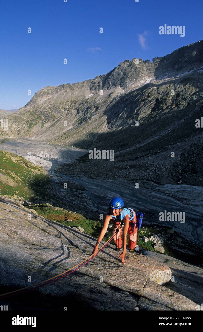 young woman climbing on granite slabs, Bächlital, Grimsel, Berner ...