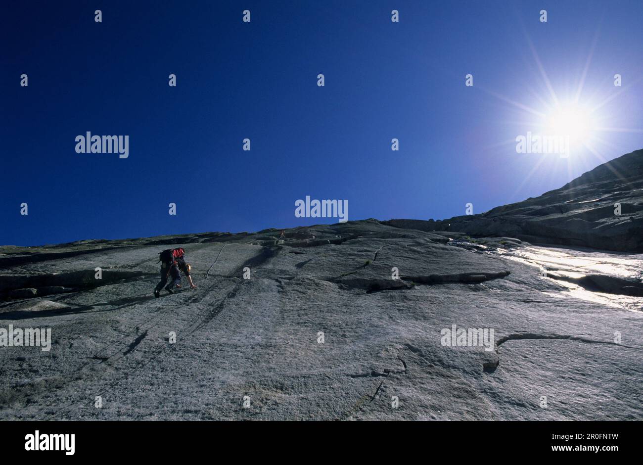 Climber on granite slab, Klein Furkahorn, Urner Alps, Canton of Uri ...