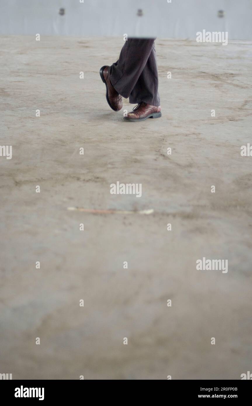 Man standing behind a billboard Stock Photo - Alamy