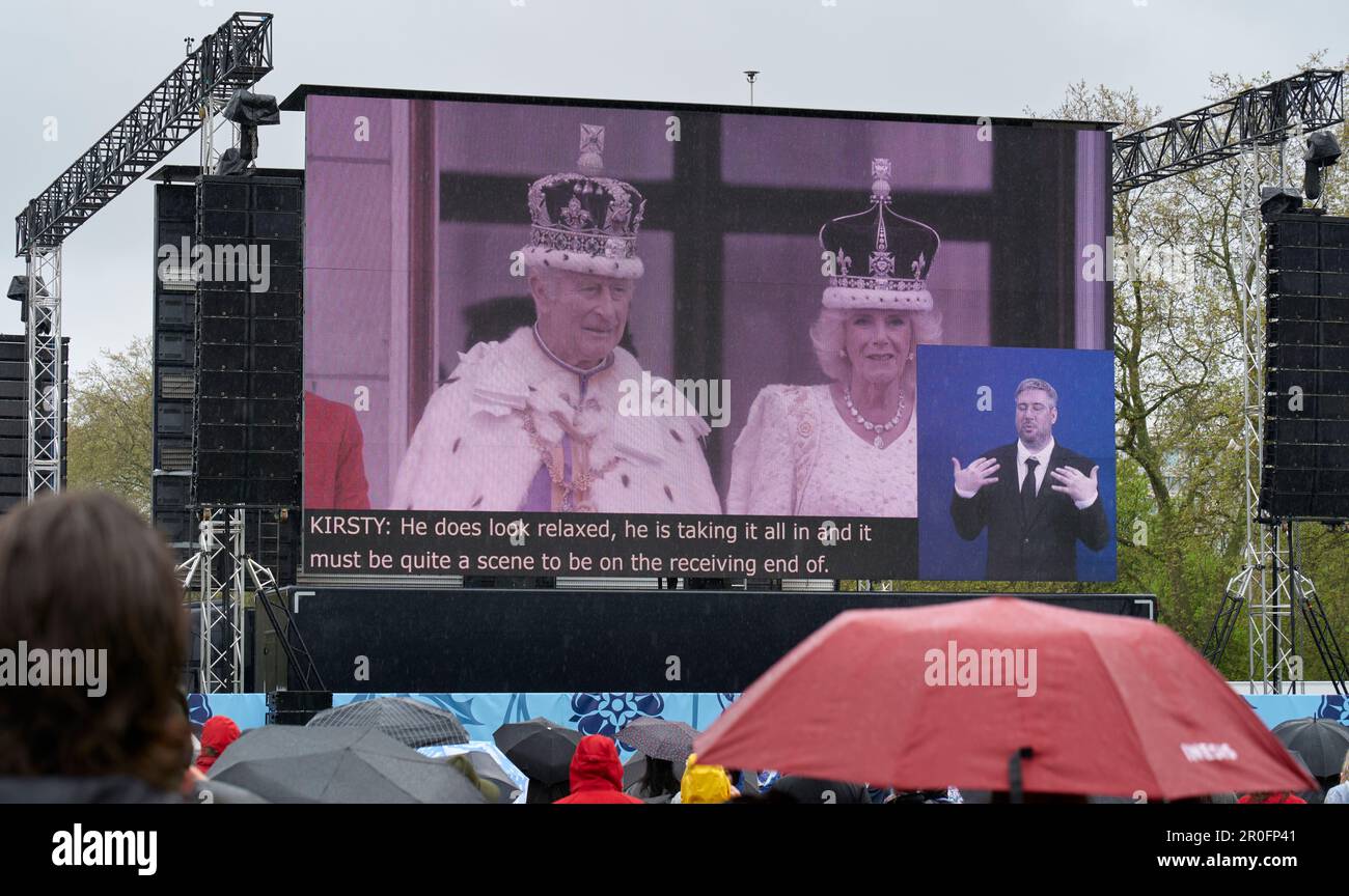 King Charles III and Queen Camilla on the viewing screen in Hyde Park ...