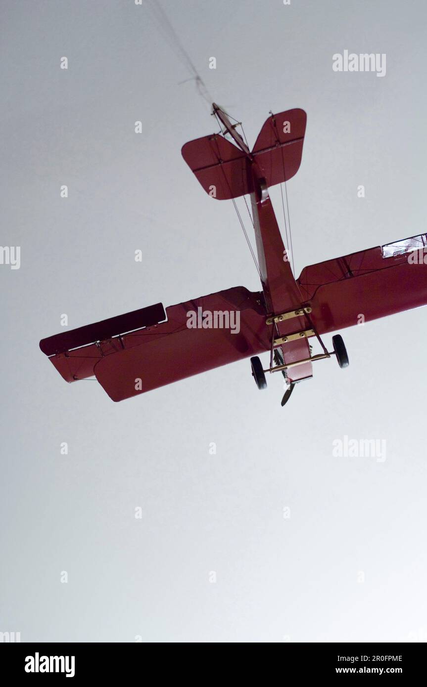 A red model airplane flying, Toy Stock Photo - Alamy