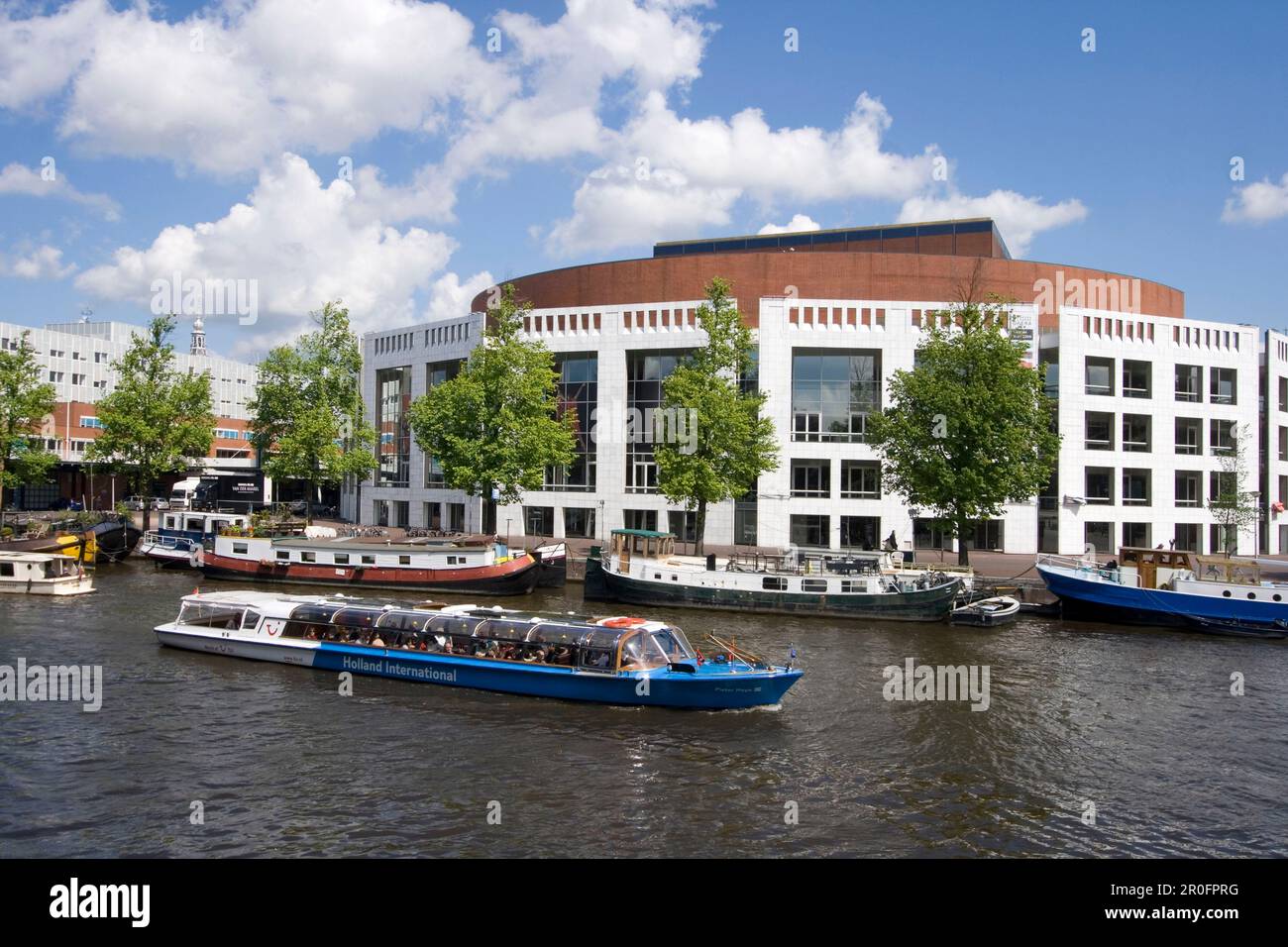 Amsterdam opera house canal boat Stock Photo - Alamy