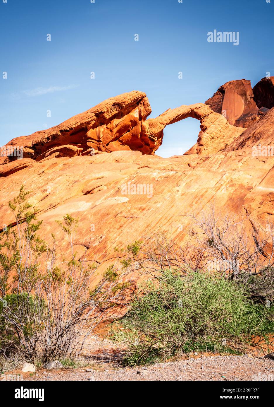 Moon rising over Arch Rock formation in Valley of Fire State Park in ...