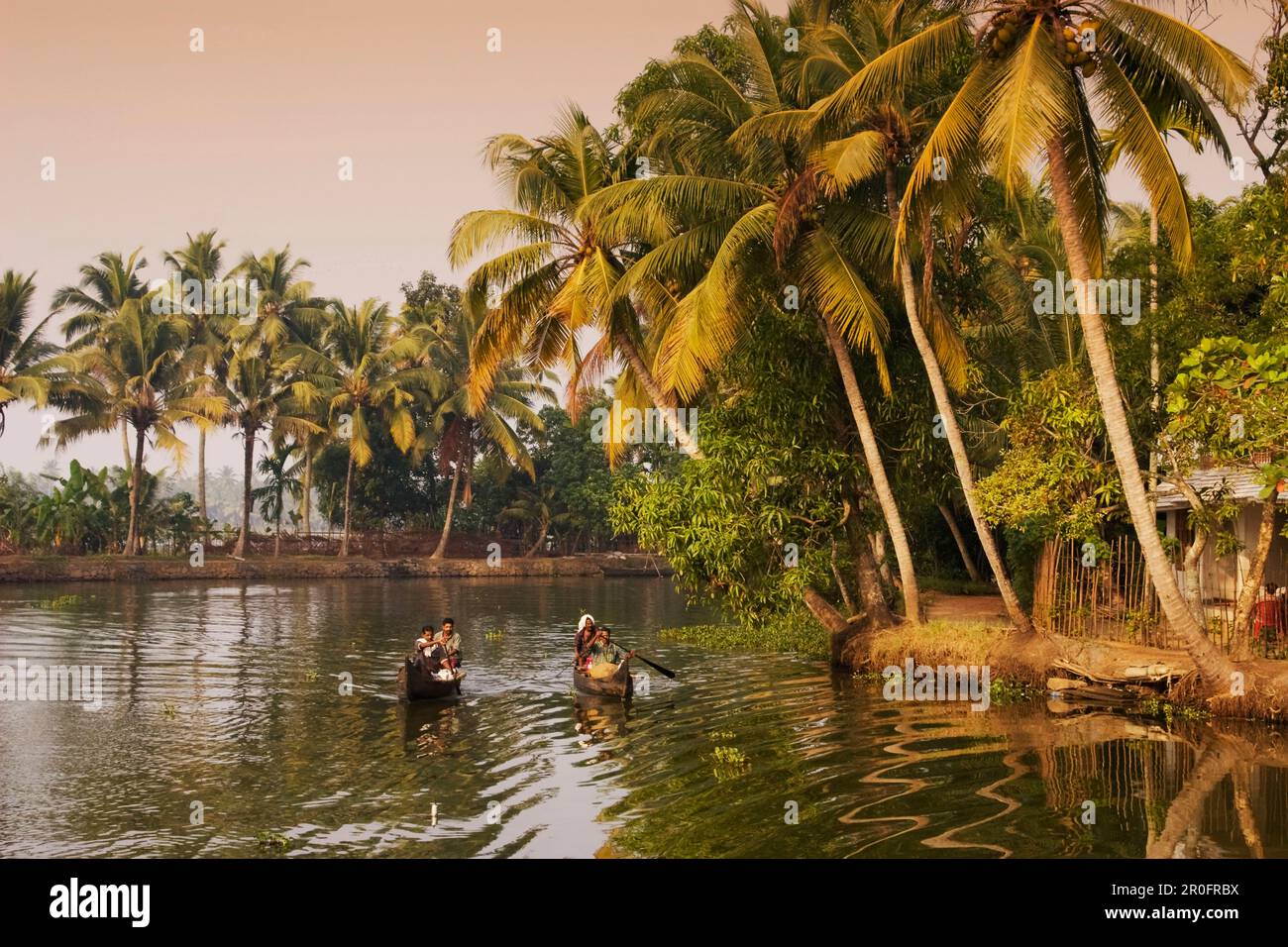 India Kerala backwaters indian people in canoe Stock Photo - Alamy