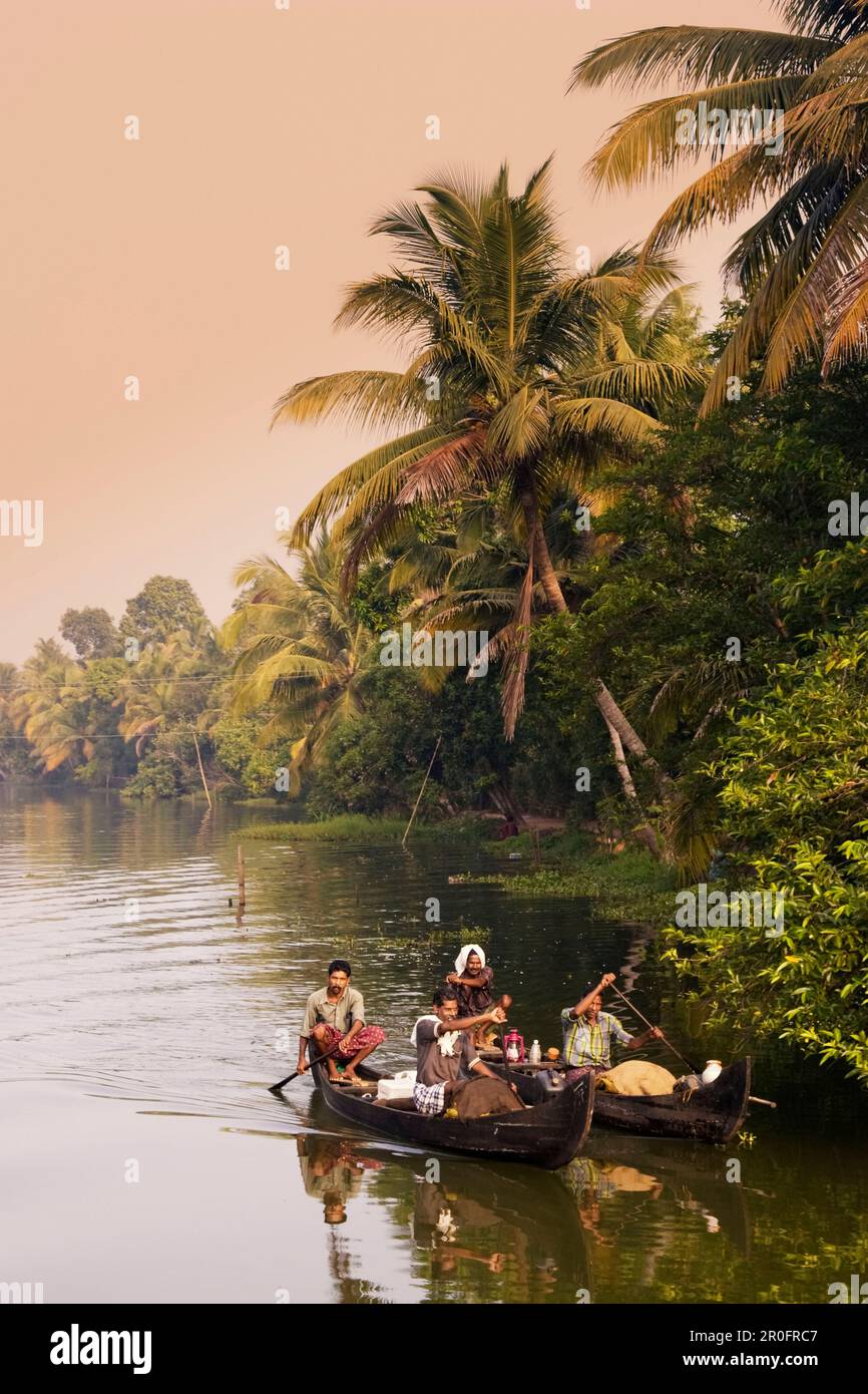 India Kerala backwaters indian people in canoe Stock Photo - Alamy