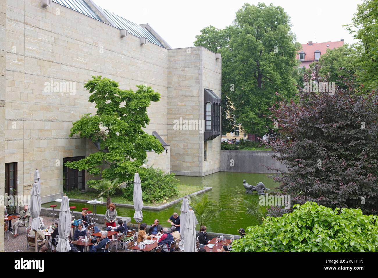 People sitting on terrace of Cafe Greco at the museum Neue Pinakothek ...