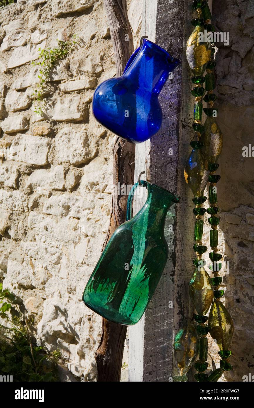 Handmade glass hung up outside a shop, glass craftsman, glassblower ...