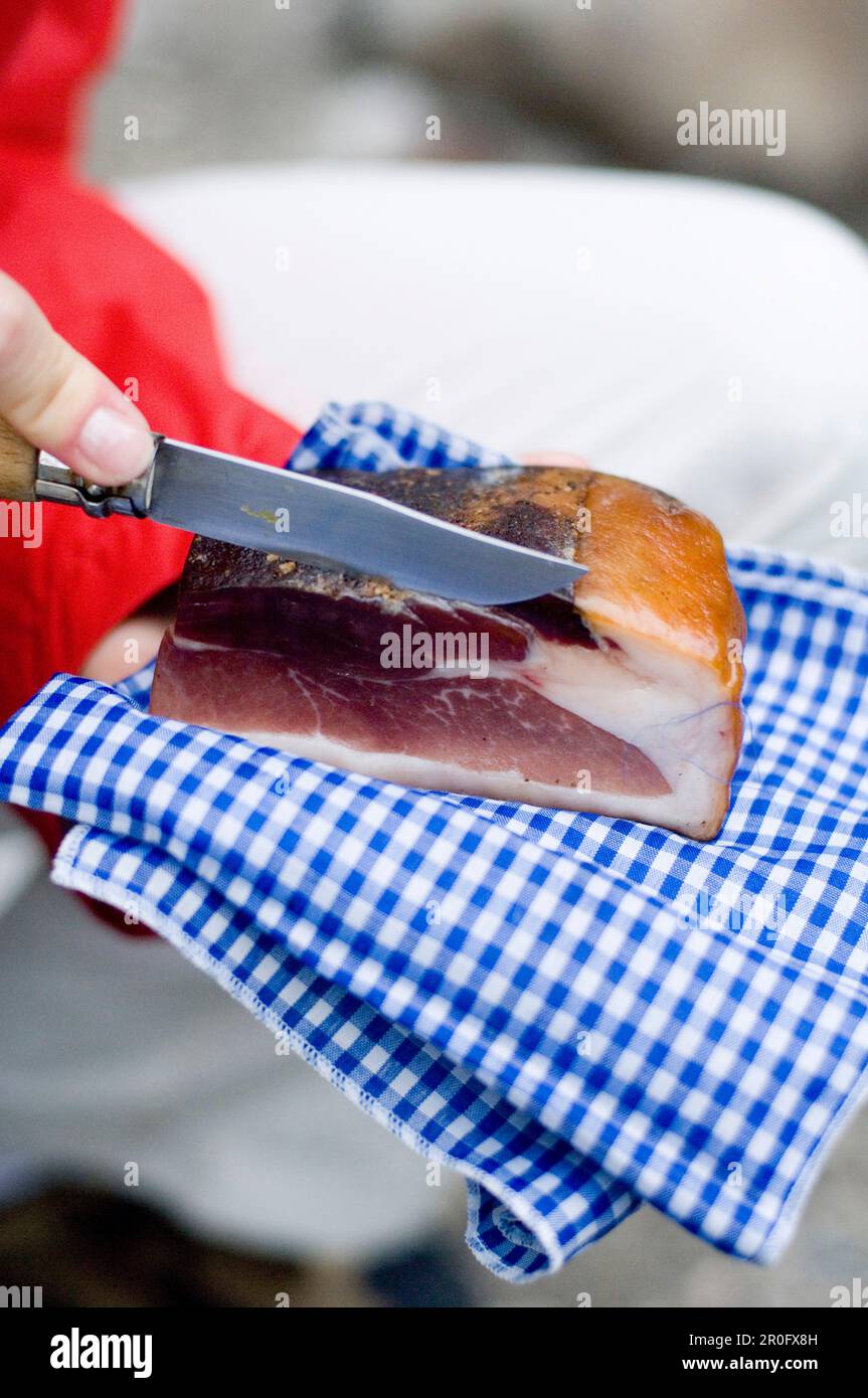 Person cutting ham Stock Photo - Alamy