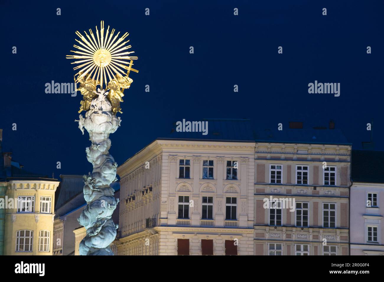 Holy Trinity column at central square at night, Linz, Upper Austria ...