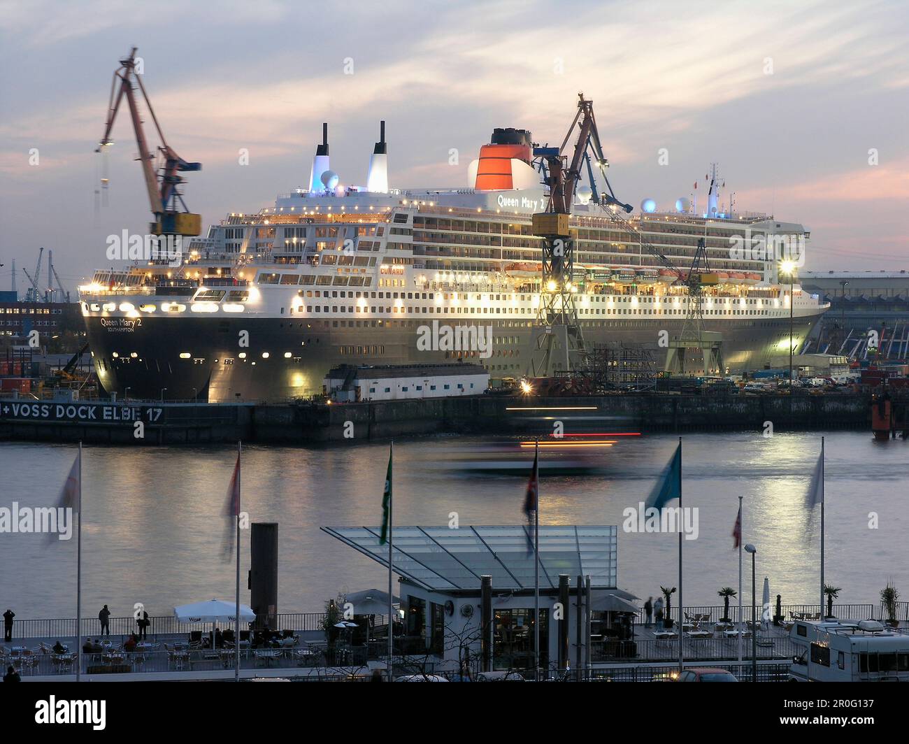 Cruise ship Queen Mary 2 at the shipyard in the evening, Hanseatic City ...