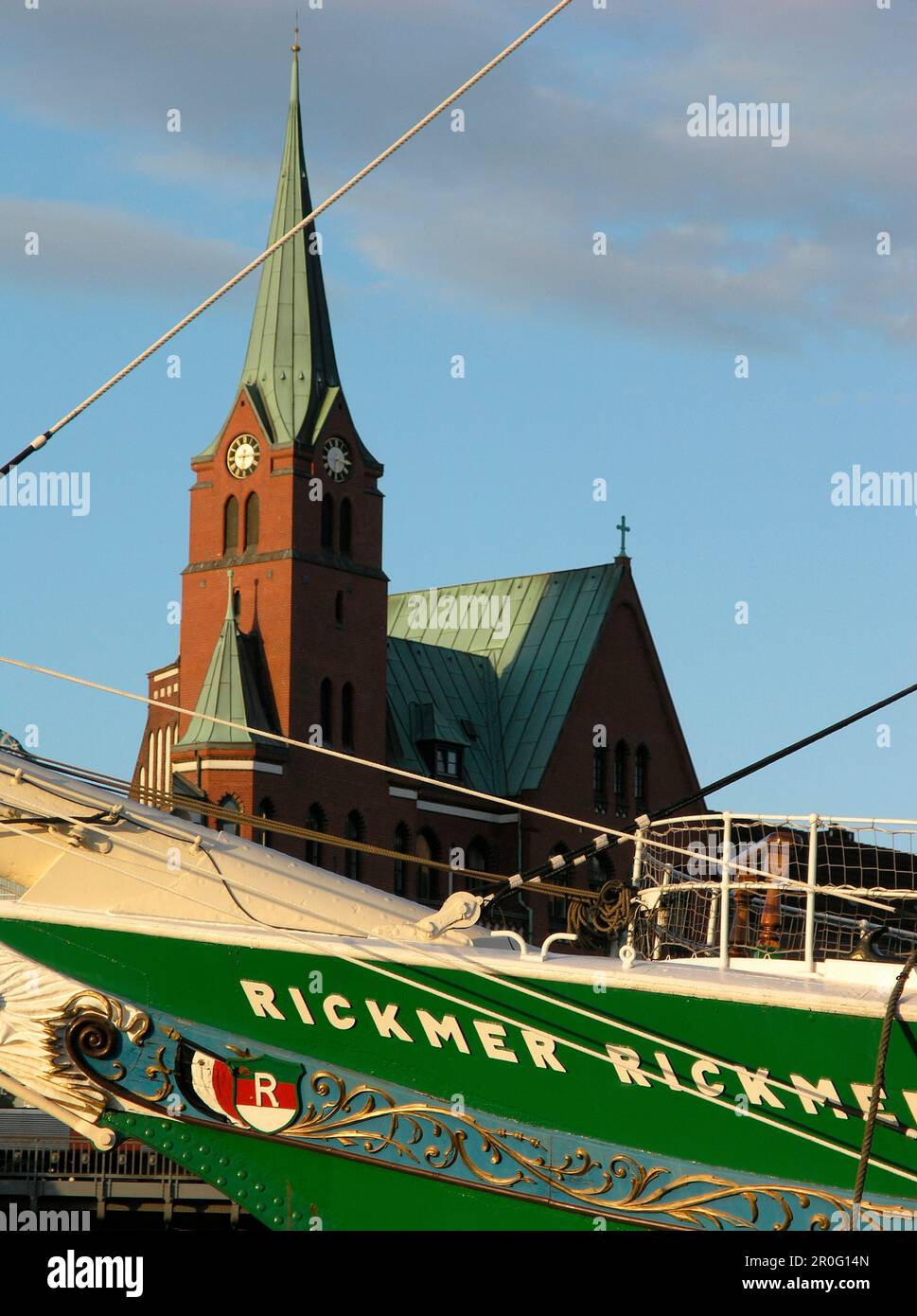 Bow of the Museum Ship Rickmer Rickmers in front of a church, Hanseatic ...