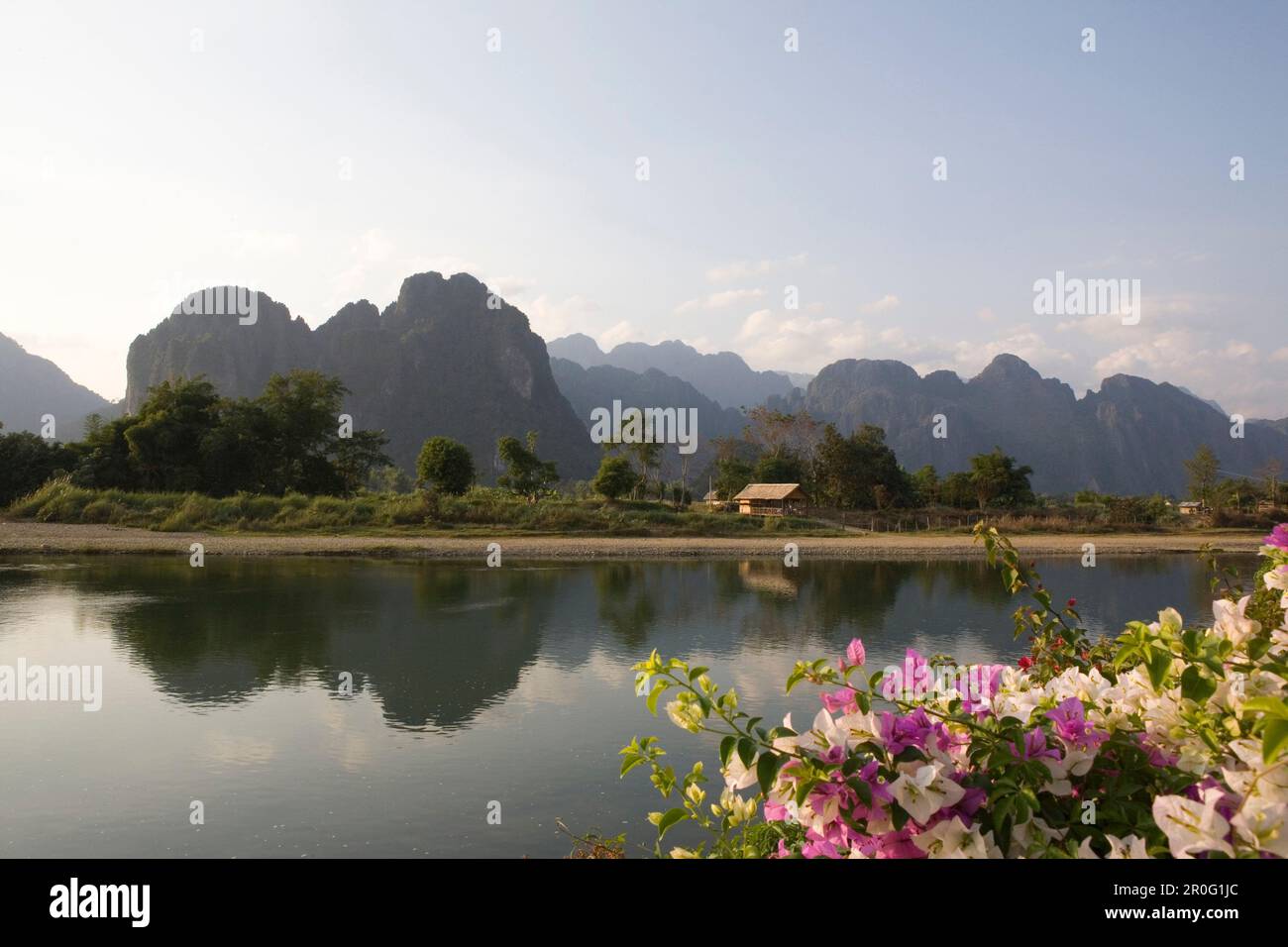Karst mountains at the river Nam Xong in the sunlight, Vang Vieng ...