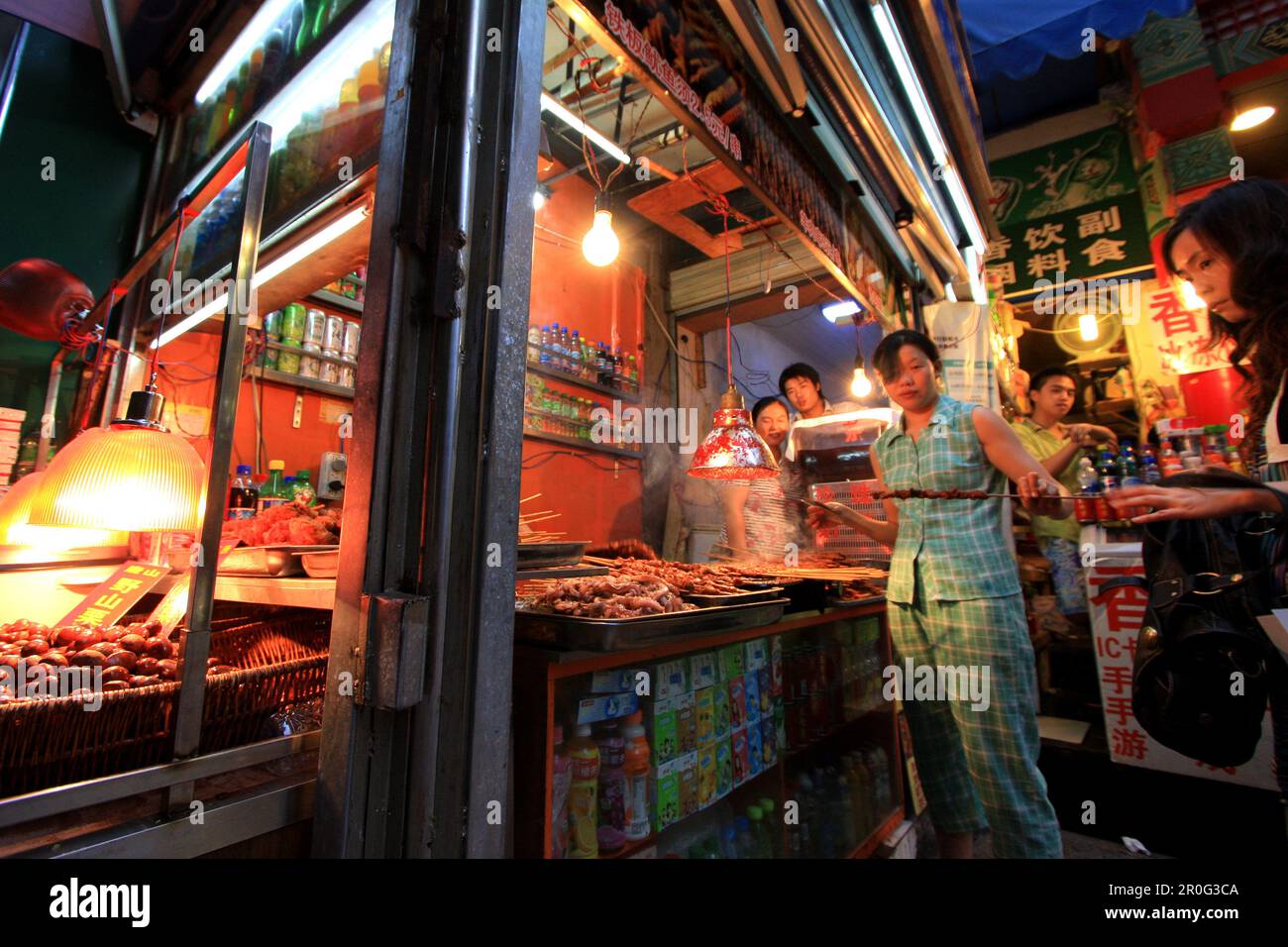 Typical little shop with sales woman in Chongqing, China, Asia Stock ...