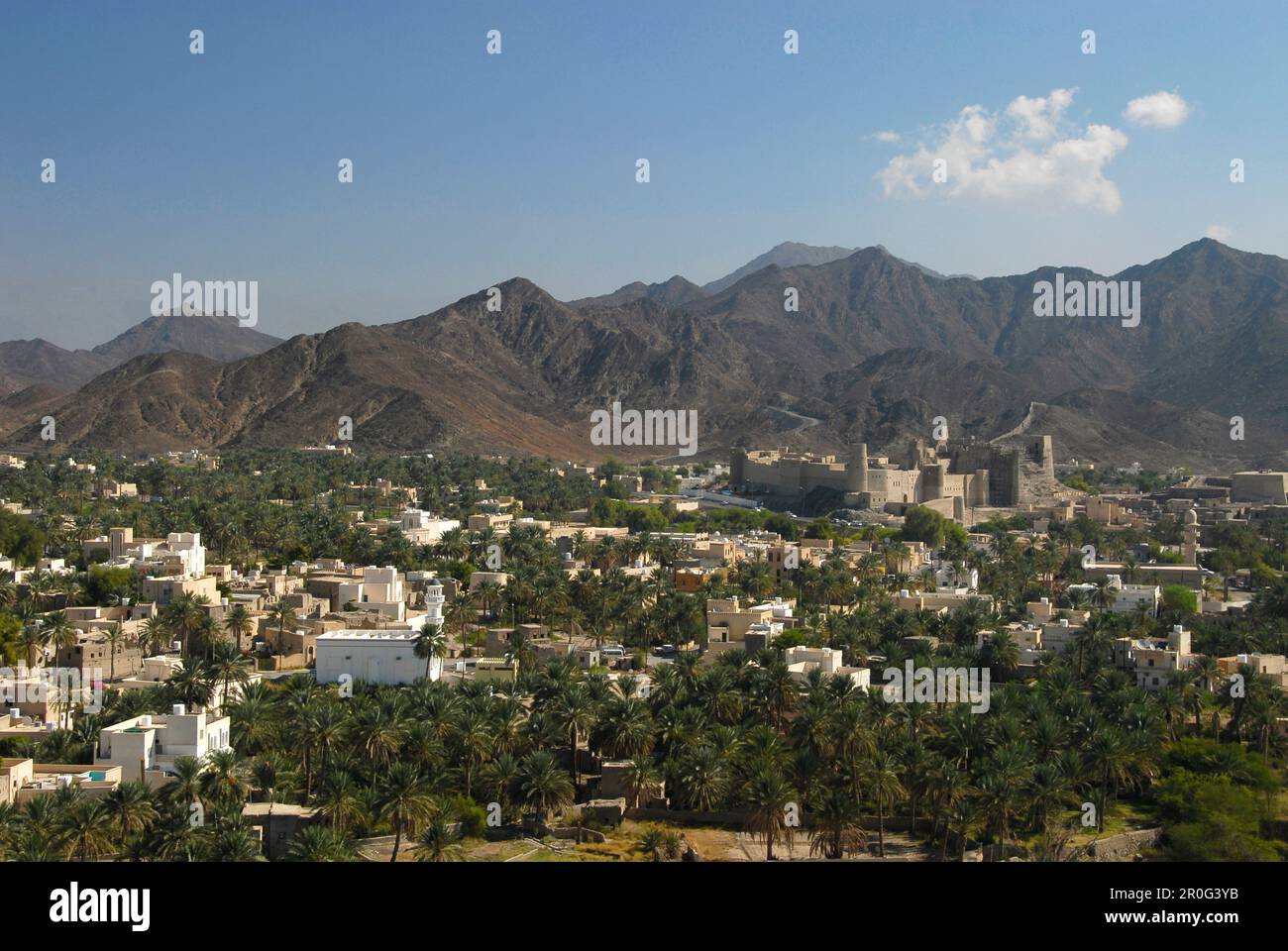 View at oasis town Bahla and the Hisn Tamah fort under blue sky, Oman ...