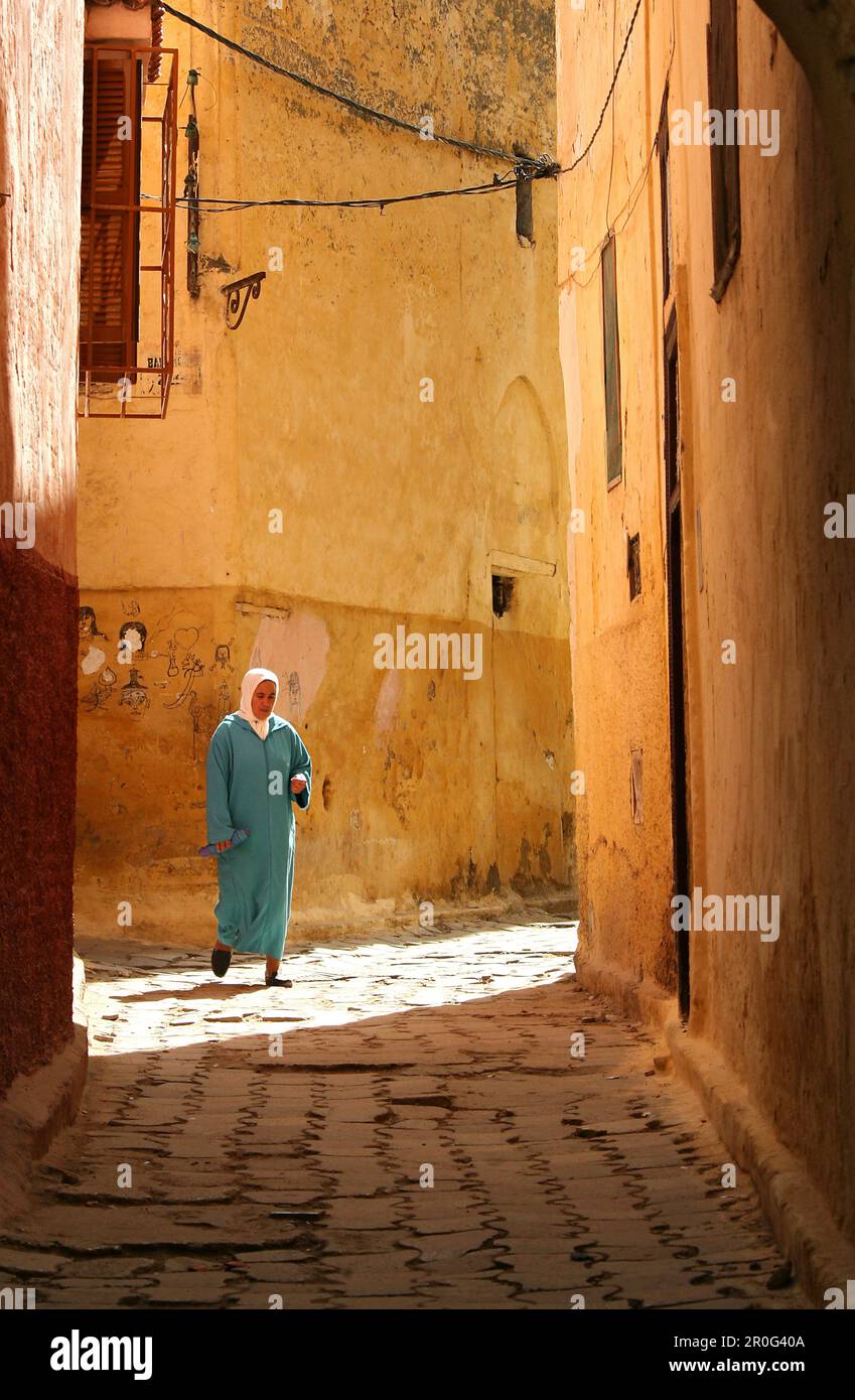 Moroccan woman at an alley of Meknes' medina, Meknes, Morocco, Africa ...