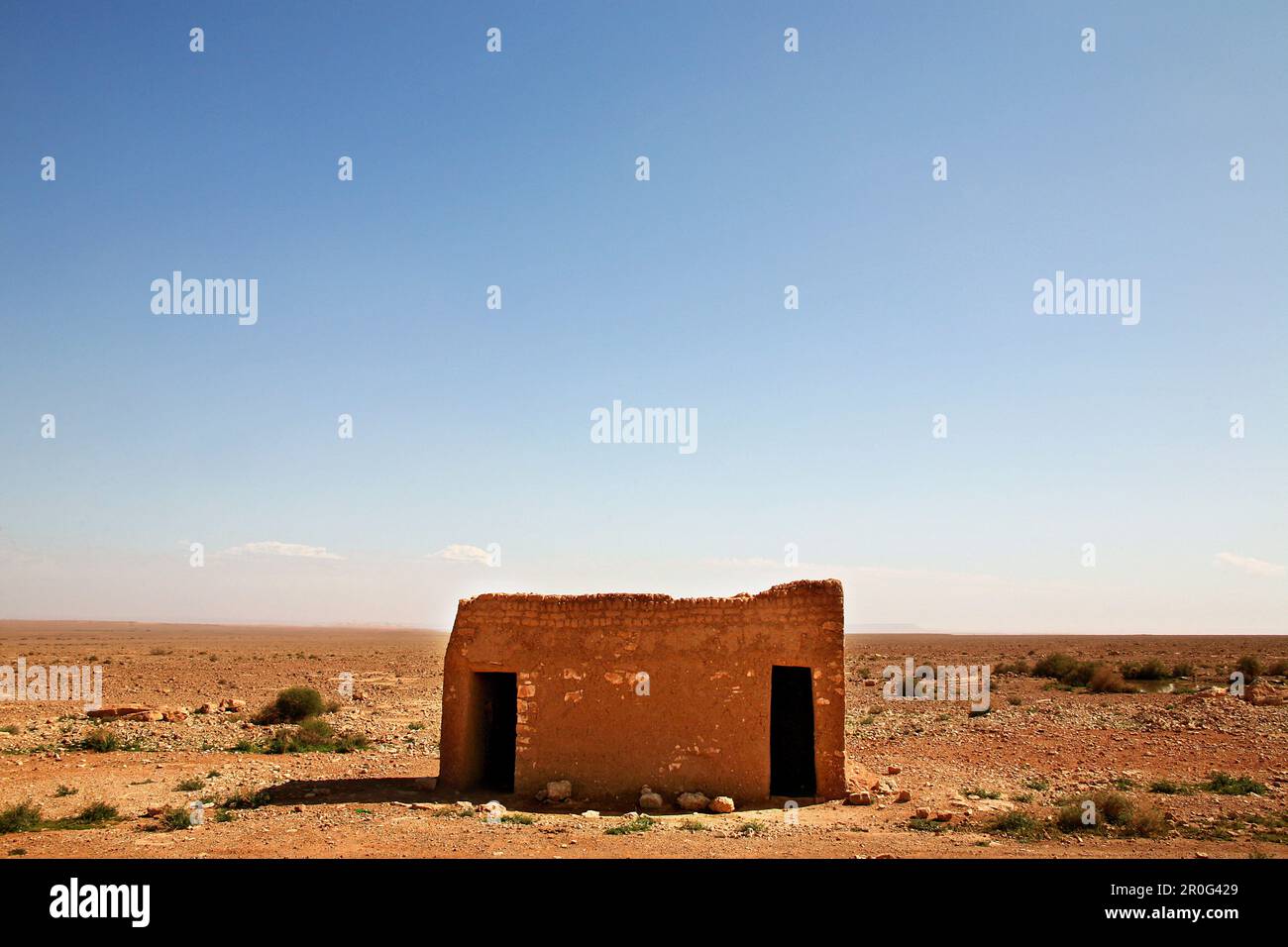 Lonesome, decayed hut at Erg Chebbi desert under blue sky, Morocco ...