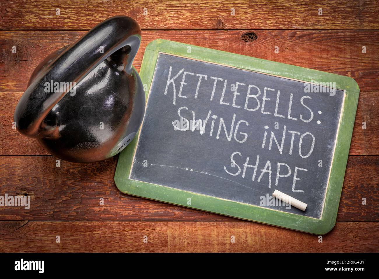 kettlebells - swing into shape, motivational white chalk text on a ...