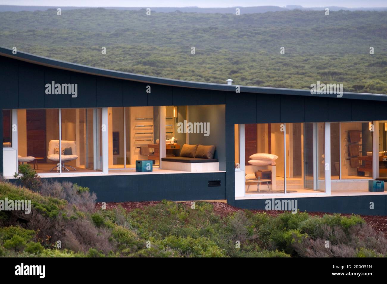The illuminated deserted rooms of the Southern Ocean Lodge at the bush ...