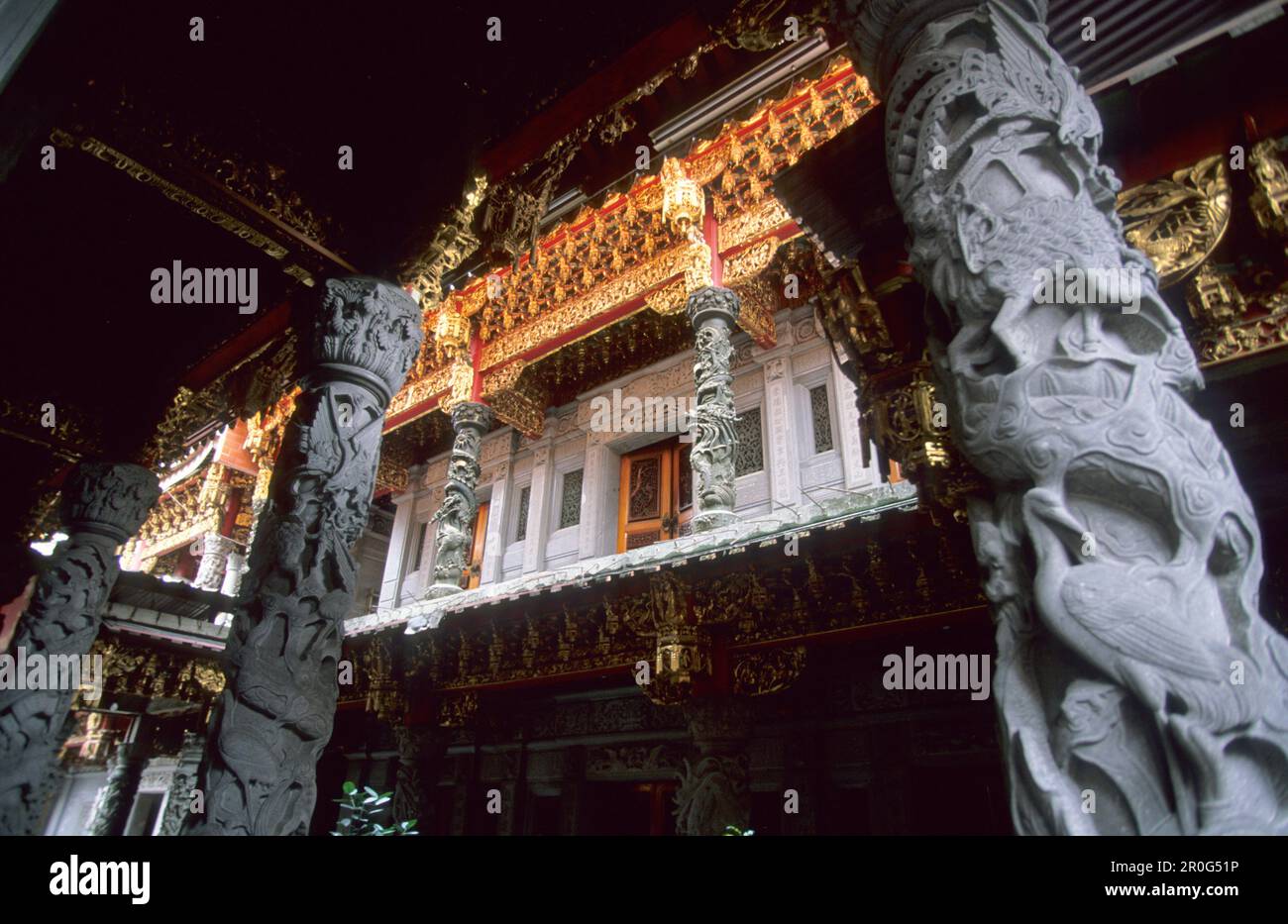 Artful decorated columns in front of the Tsushih temple in the city of ...