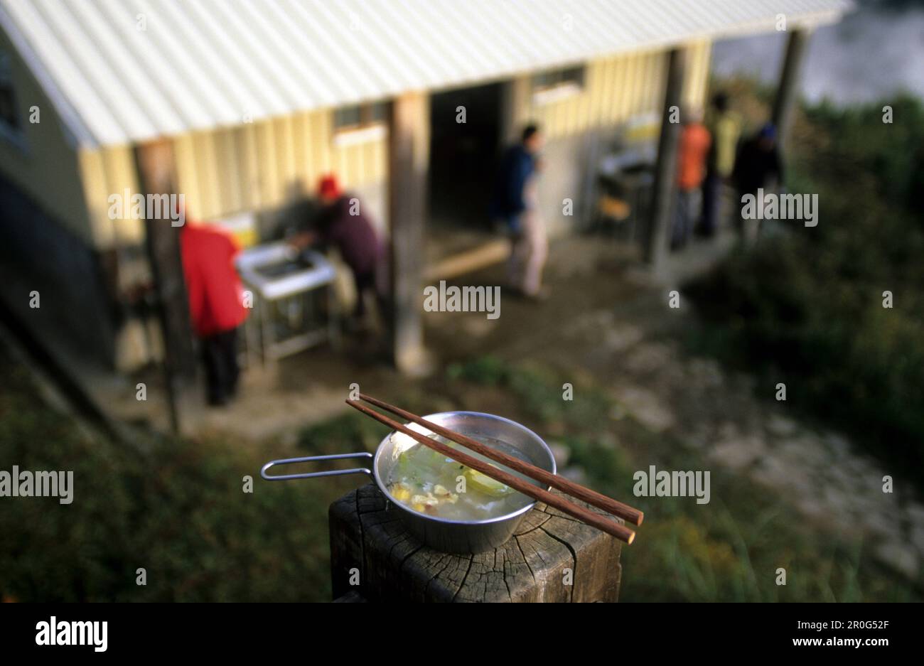 View at little cooking pot with chop sticks in front of mountain hut ...