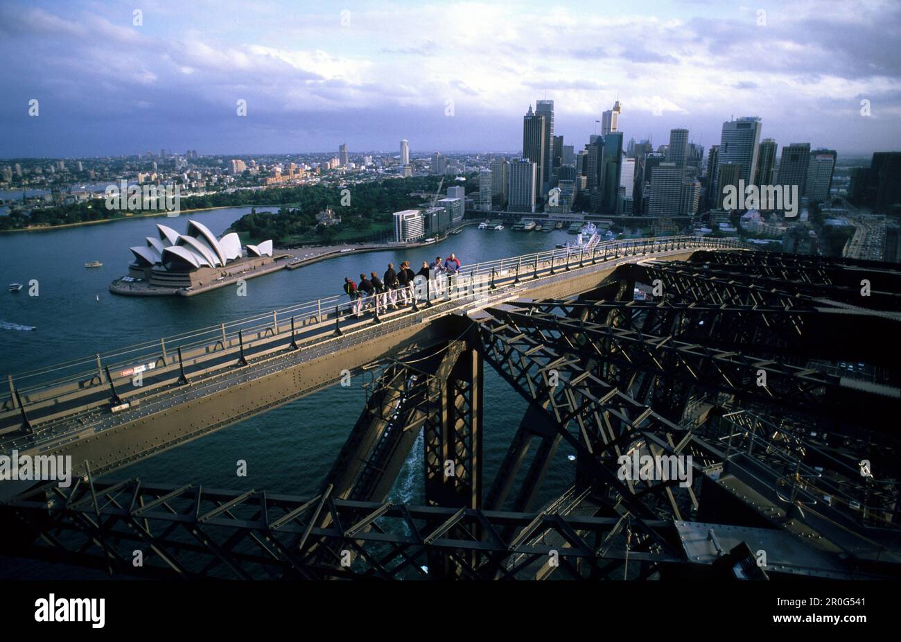 People standing on the highest steel beam of the Harbour Bridge, Sydney, New South Wales ...