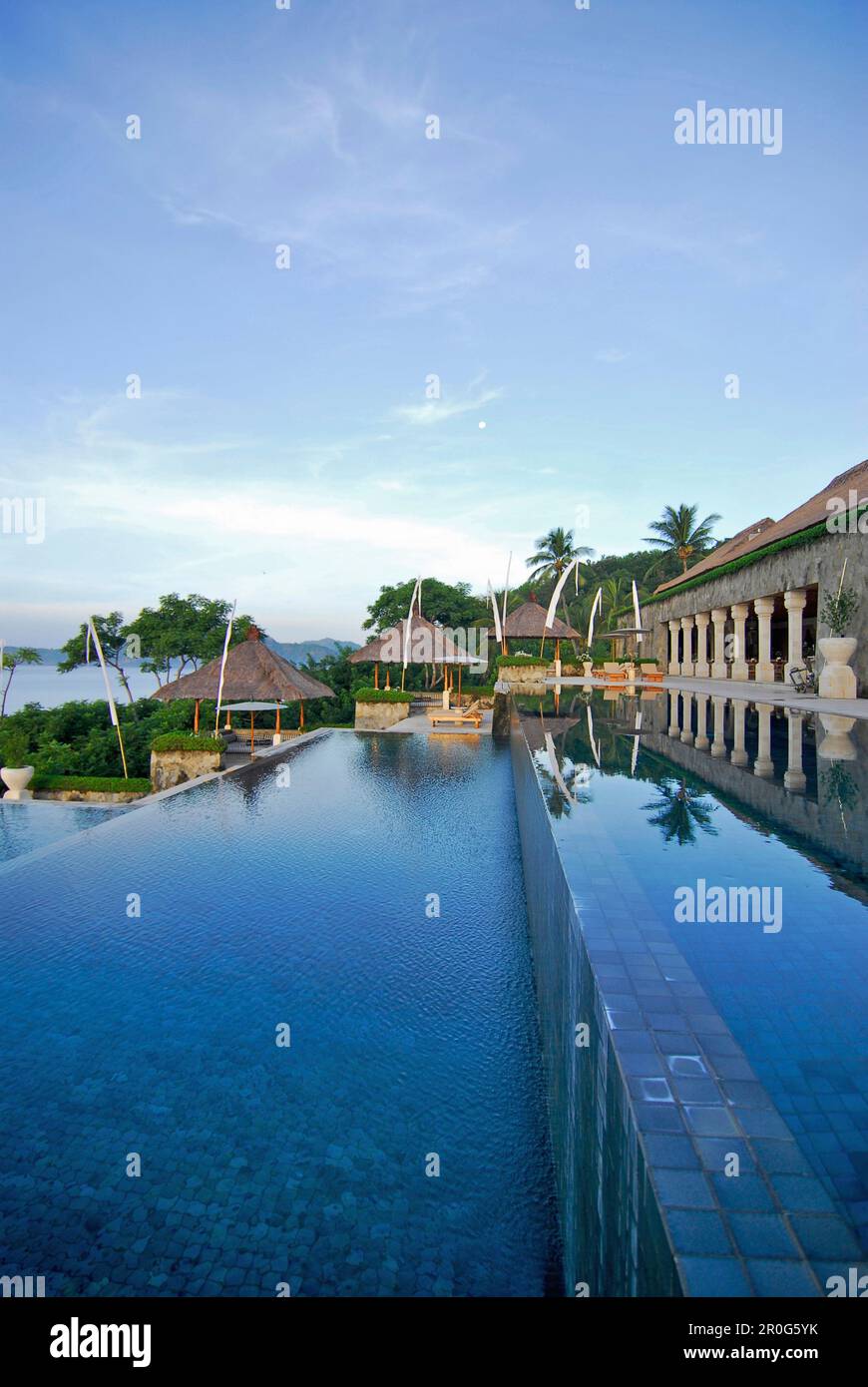 The deserted Infinity pool at Amankila Resort in the morning, Candi ...