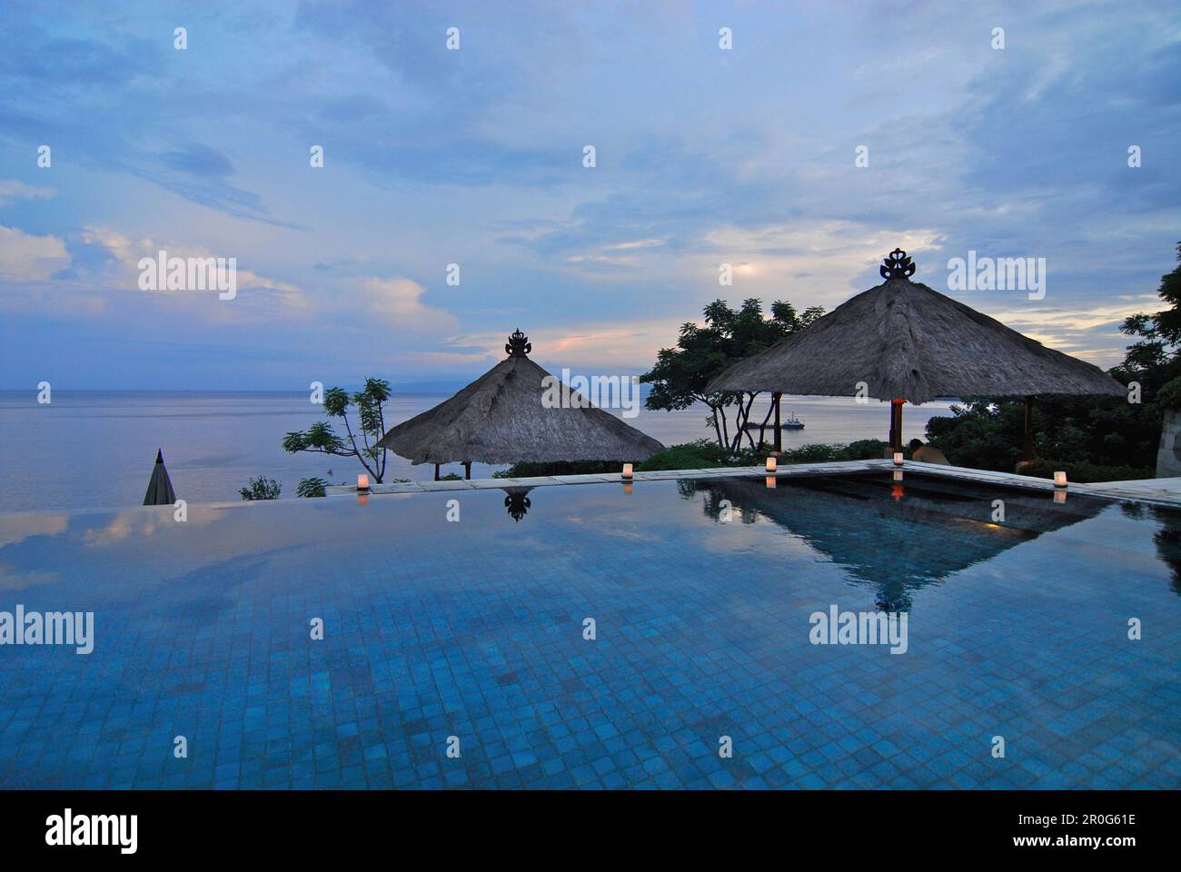The infinity pool at the Amankila Resort in the evening, Candi Dasa ...