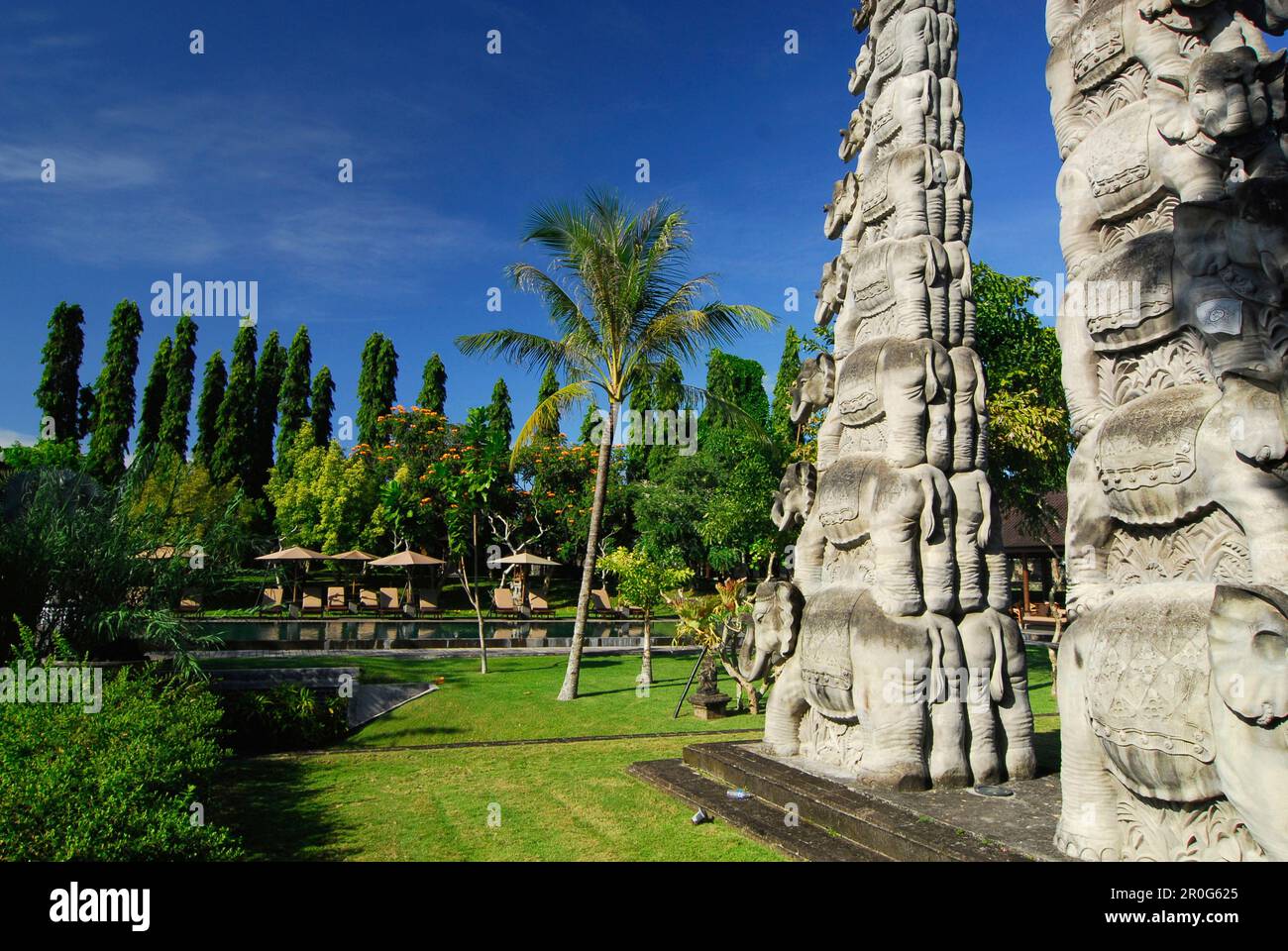 Candi, Temple gate at the garden of the Chedi Club under blue sky, GHM ...