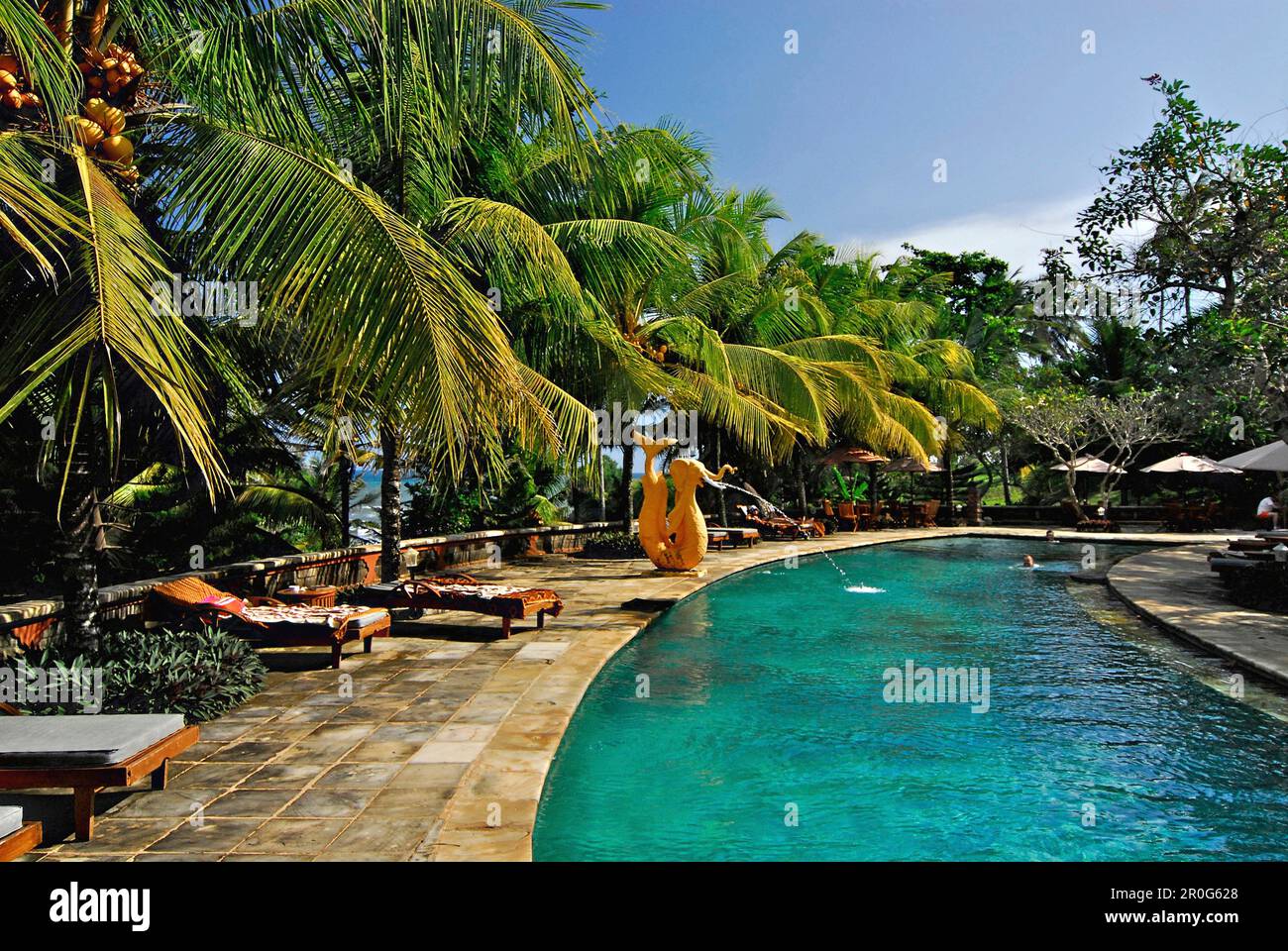 Pool under palm trees, Gajah Mina Beach Resort, South Bali, Indonesia ...