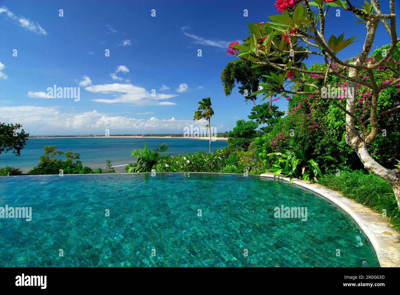 Pool under blue sky with seaview, Four Seasons Resort at Jimbaran ...