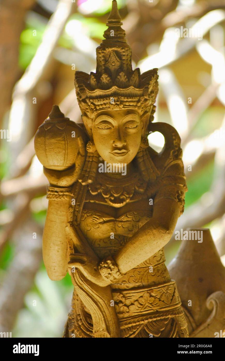 Balinese statues at the garden of the Matahari Hotel, Pemuteran, Bali ...