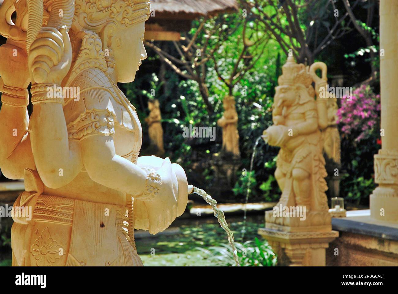 Balinese statues at the garden of the Matahari Hotel, Pemuteran, Bali ...