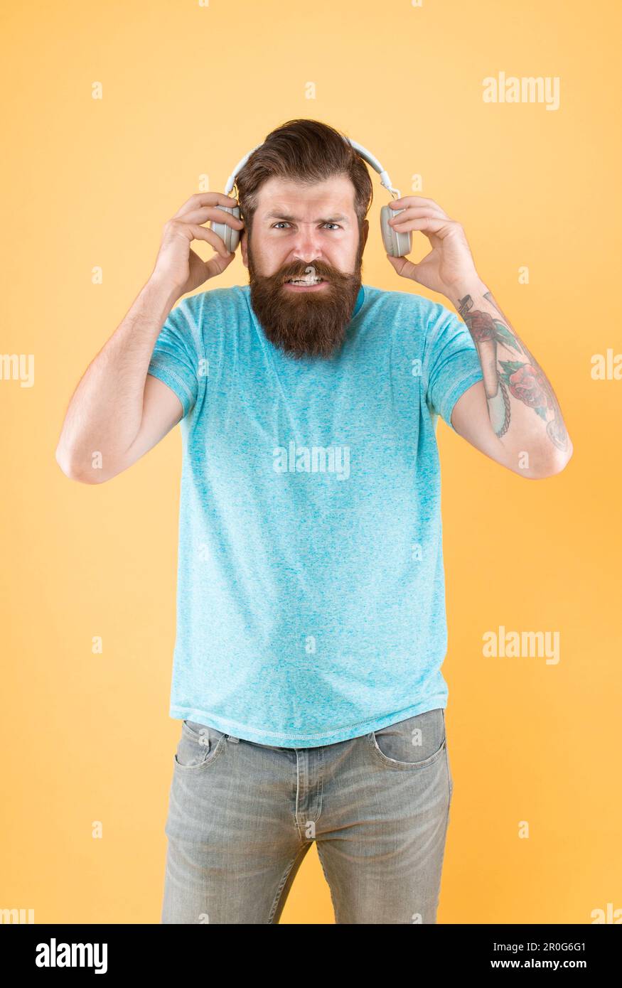 Hateful song. Music taste. Bearded guy dislike music. Irritating sound ...