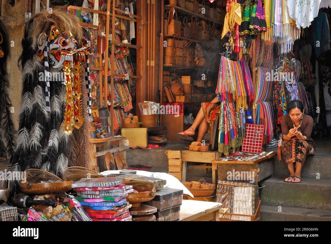 Two women at a market stand in the centre of Ubud, Central Bali ...