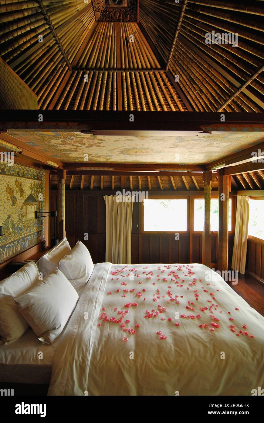Bed covered with petals at a bungalow of the Amandari Resort, Yeh Agung ...