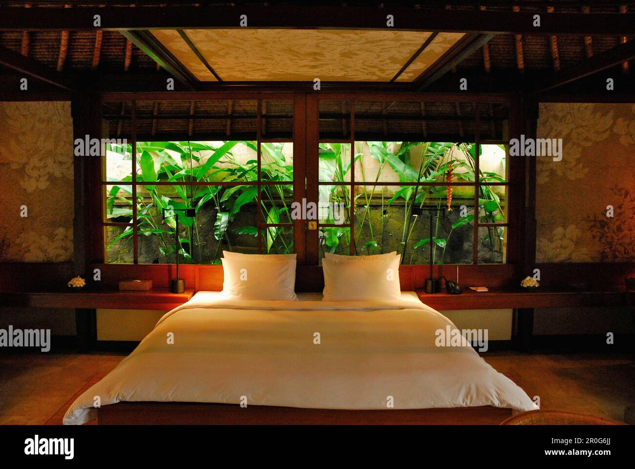 Bed at a bungalow of the Amandari Resort, Yeh Agung valley, Bali ...