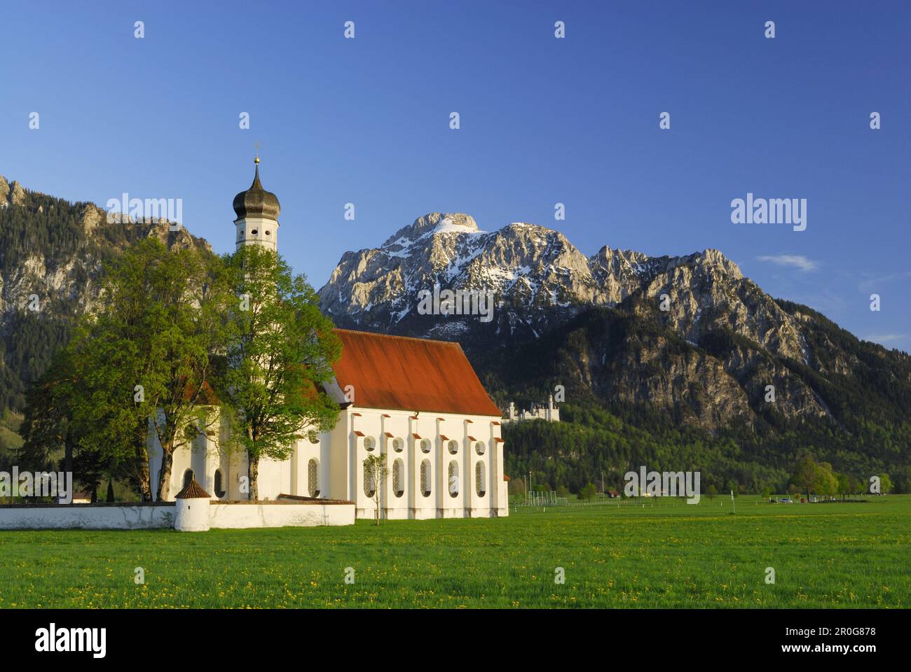 St. Coloman church with Neuschwanstein Castle, near Schwangau, Allgaeu ...
