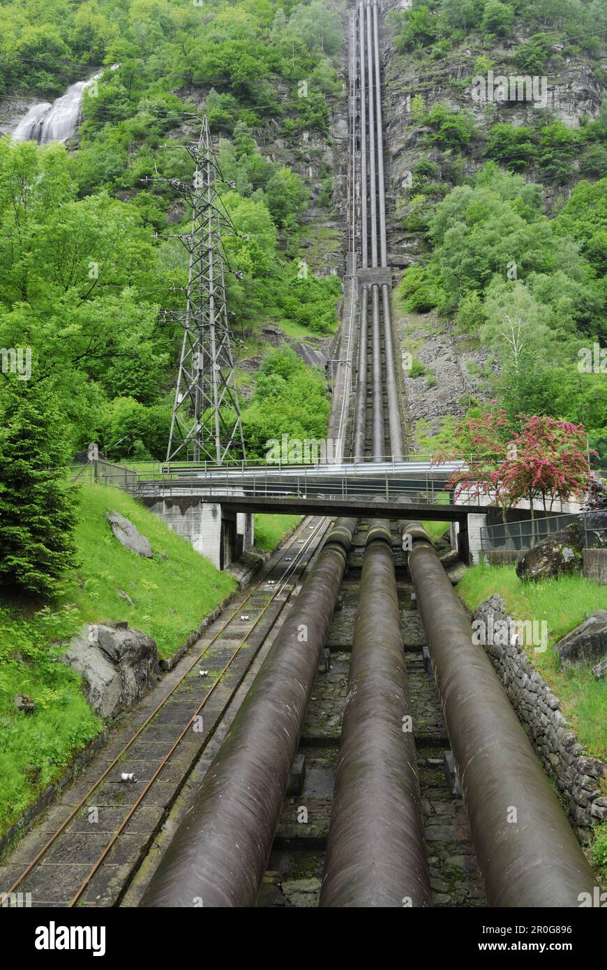 Three pressure pipes, electricity pylon and waterfall, water power ...