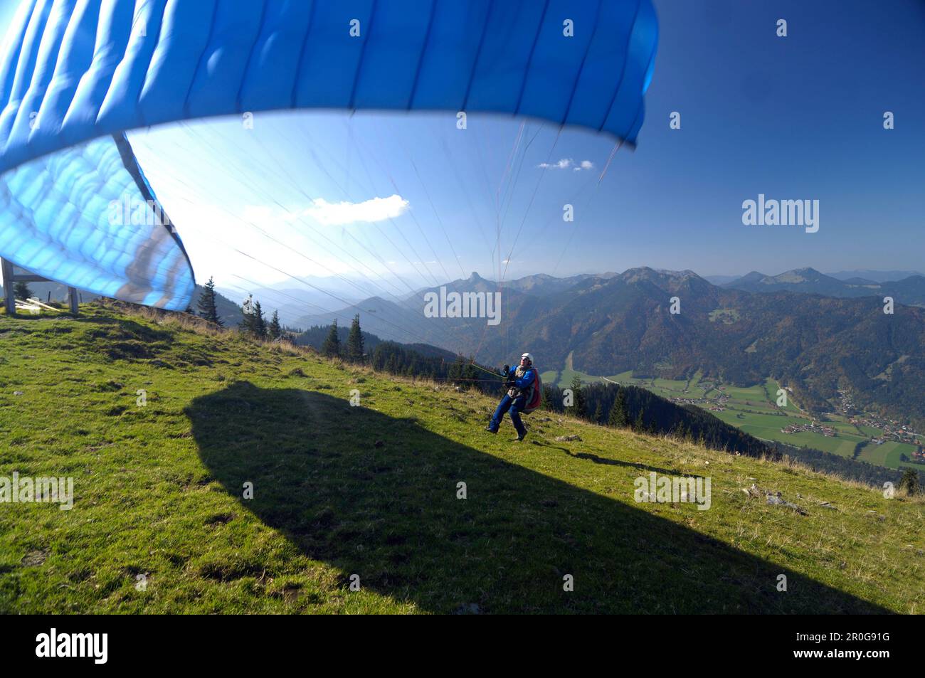 Person paragliding near Lake Tegernsee, near Rottach-Egern, Tegernsee ...