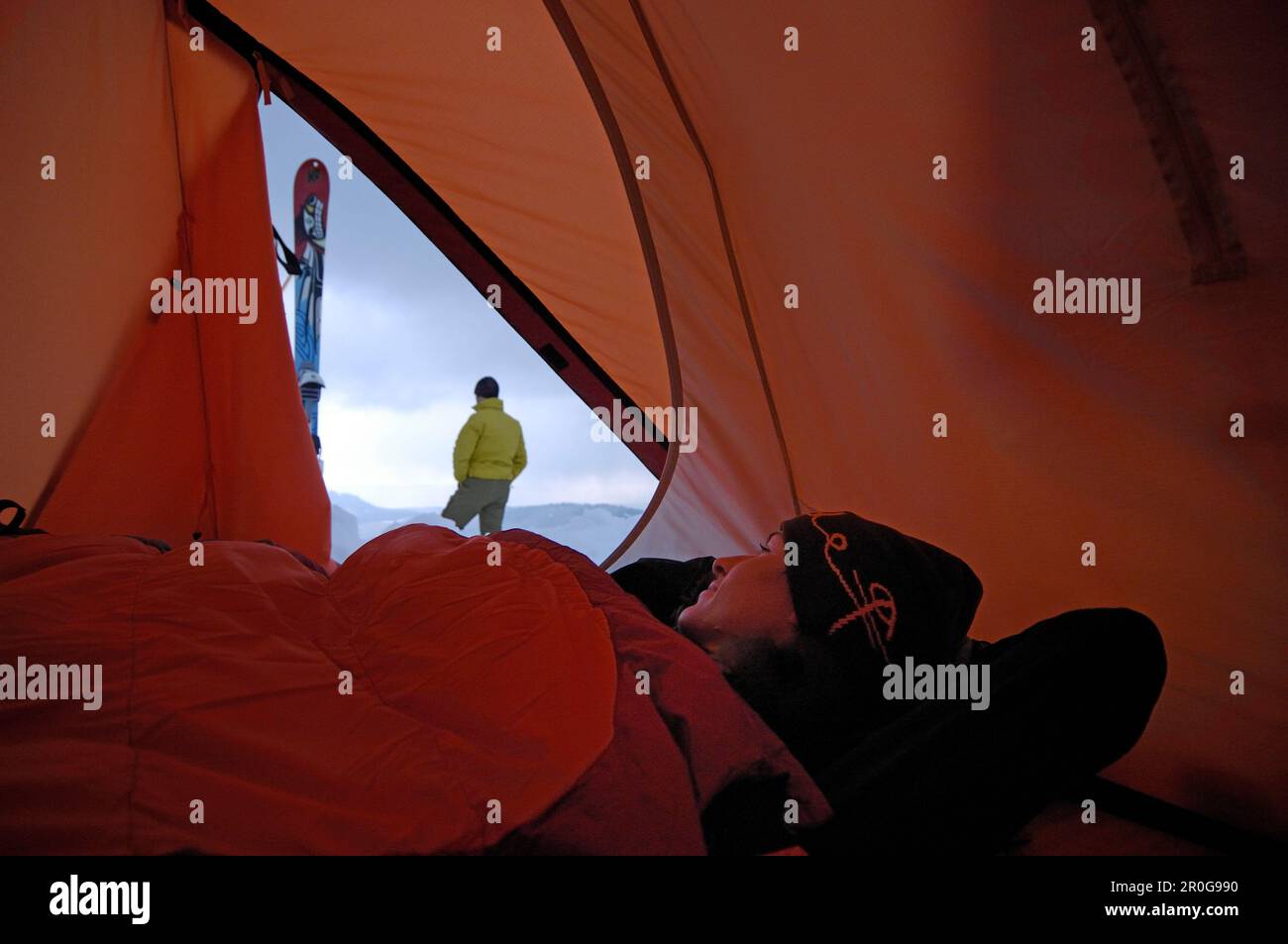 Woman inside a tent looking outside, Camping in Winter at Hochgrat ...