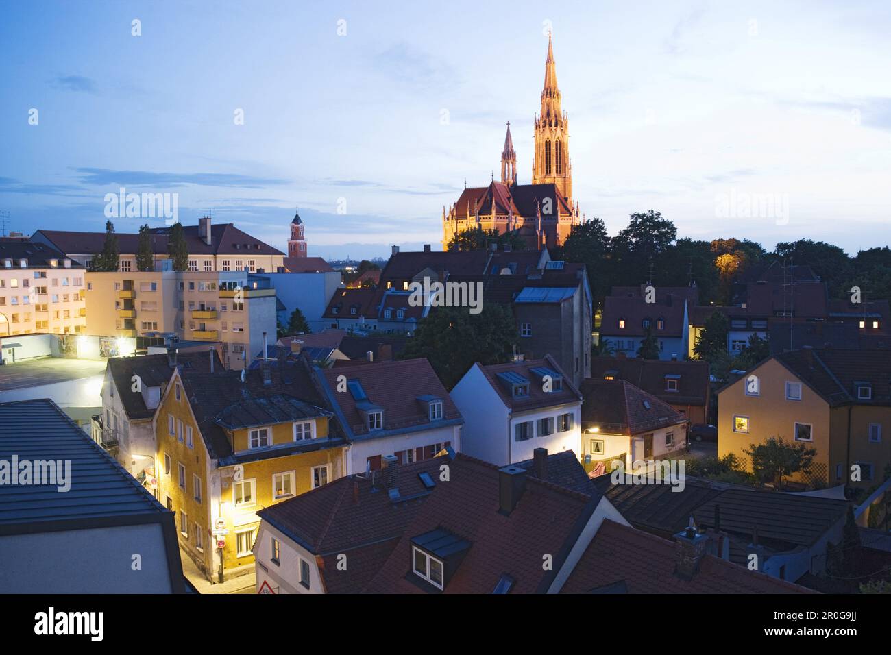 View over roofs to Holy Cross Church in the evening, Giesing, Munich ...
