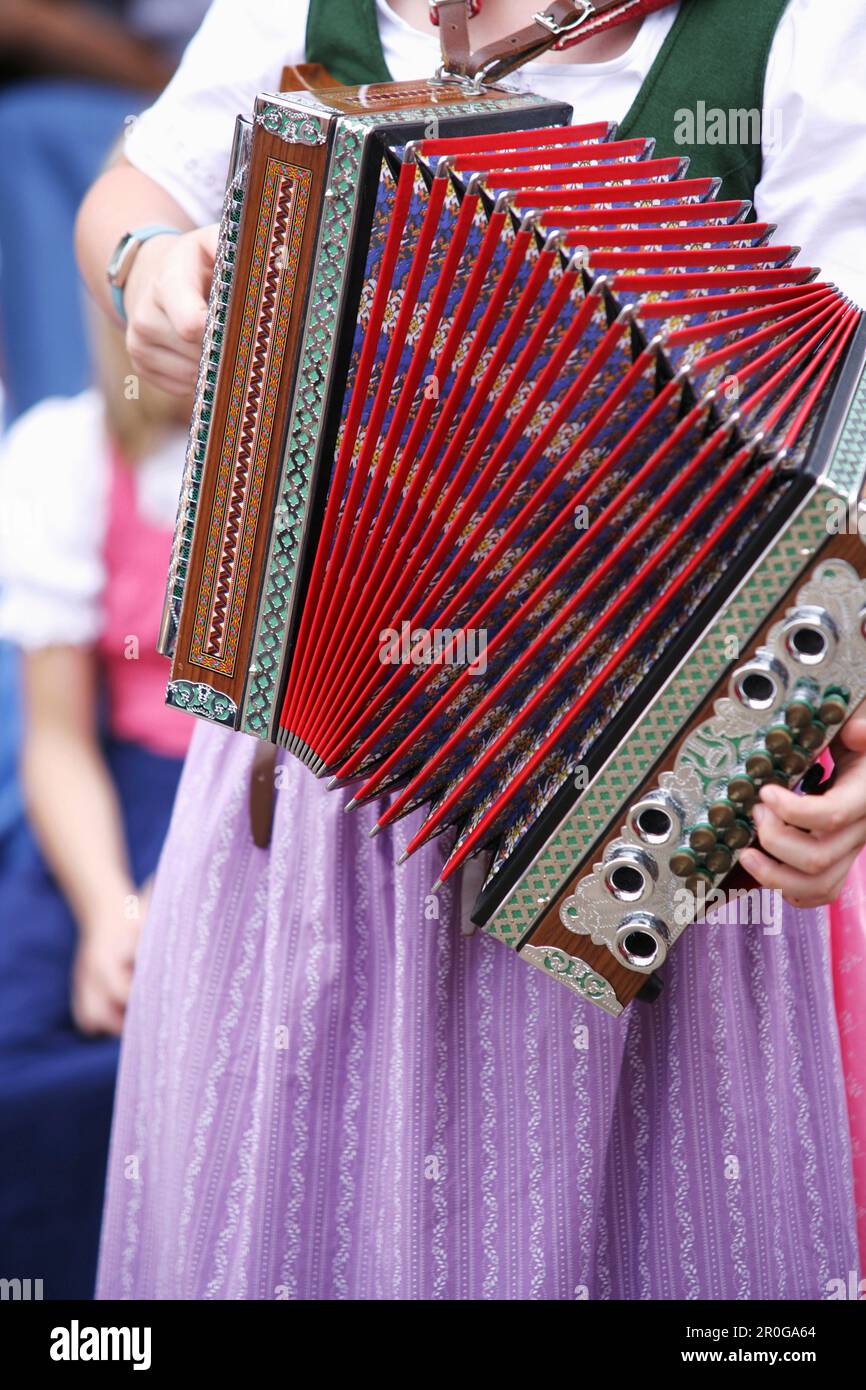 Woman playing harmonica hi-res stock photography and images - Alamy