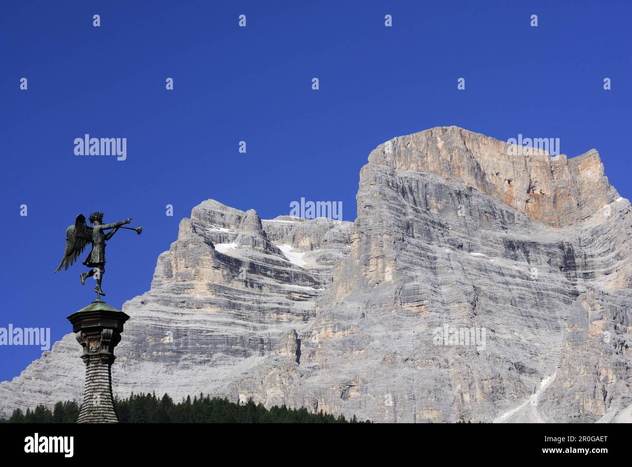 Statue of an angel on spire in front of Monte Pelmo, Dolomites, Veneto ...
