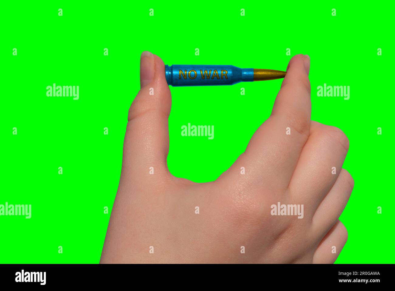 Yellow-blue rifle cartridge with the inscription NO WAR in hand on a ...