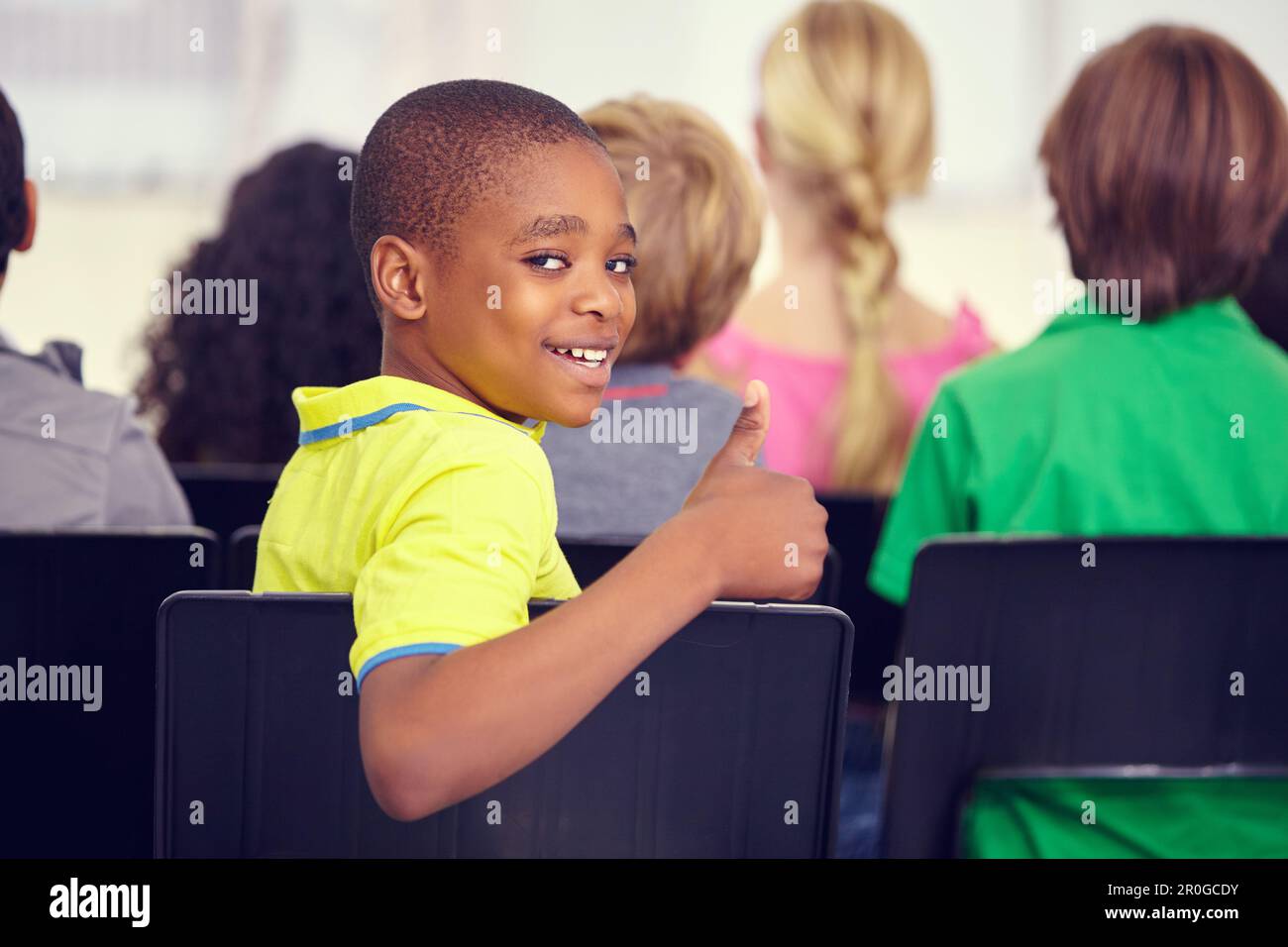 Portrait, black kid and thumbs up of student in classroom, elementary ...