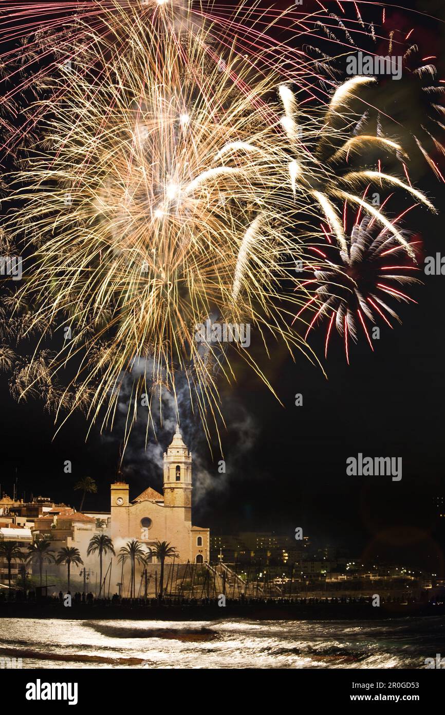 Firework display over Sitges Cathedral La Punta at night, Festival of ...