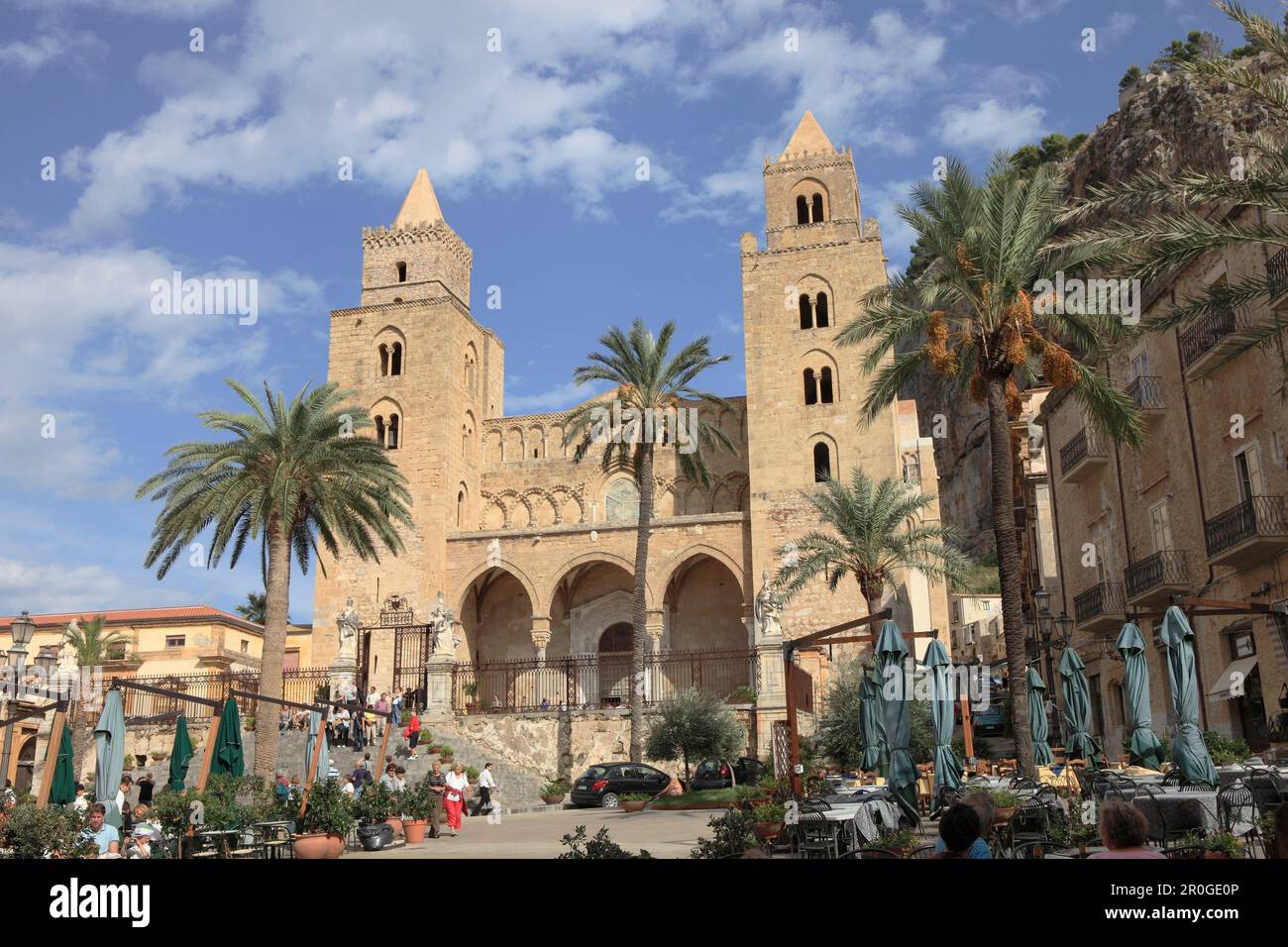 People at San Salvatore Cathedral at the square Piazza Duomo in Cefalù, Province Palermo, Sicily ...