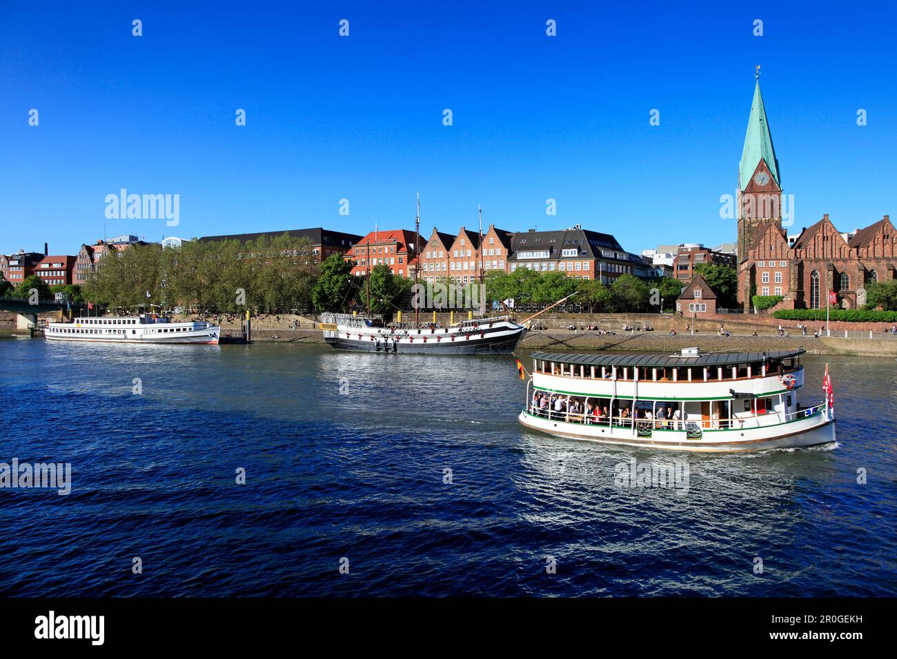 Ships at the Weser river at Martini pier in front of Martini church ...